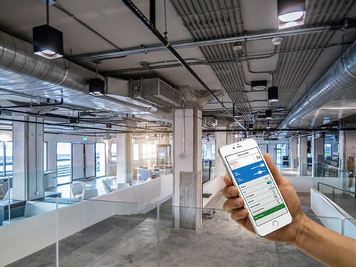 Commercial Building Smartphone Hand(500×375) - Pelican Wireless Systems